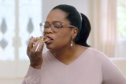 Oprah's got the cheese-pull down in social ads for new pizza | Ad Age