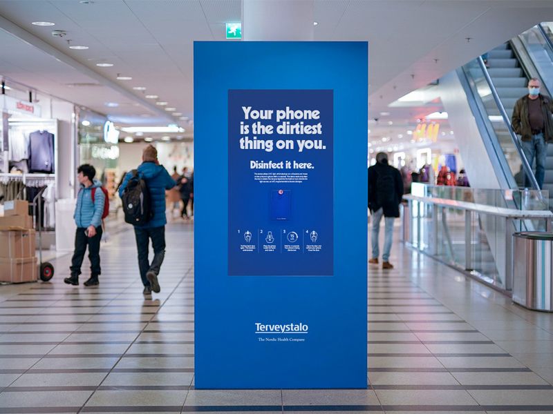 These billboards double as disinfecting stations for your phone | Ad Age