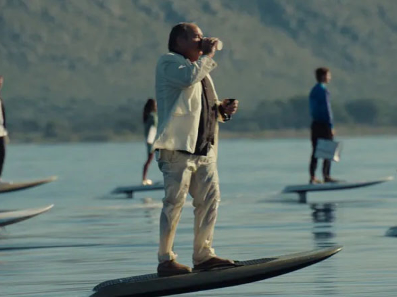 Eye-catching travel ad glides into view with people riding e-foil ...